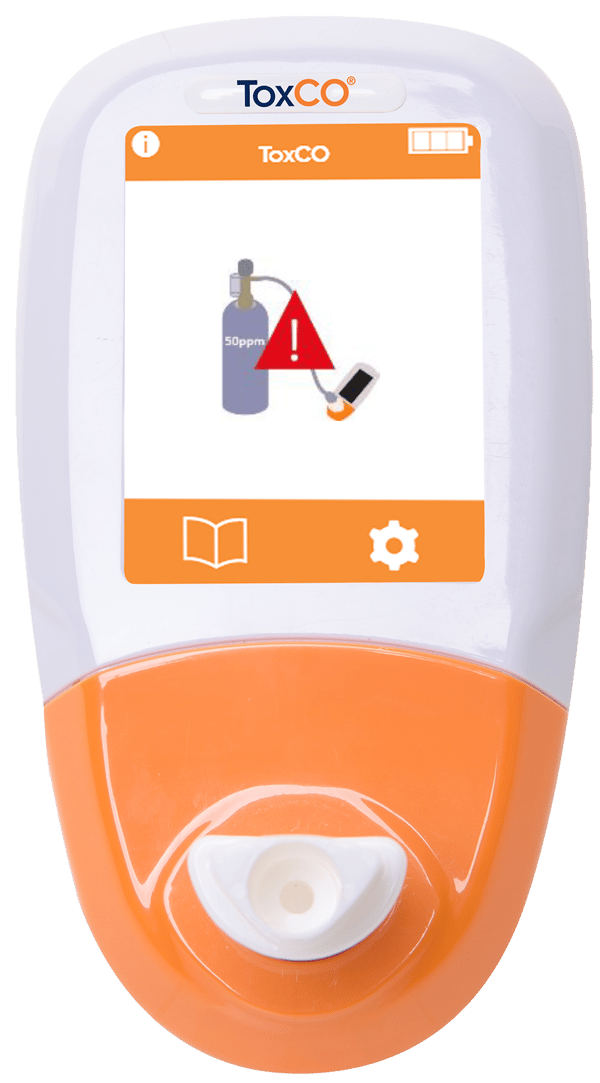 Why does my ToxCO have a gas cylinder and red warning triangle symbol?